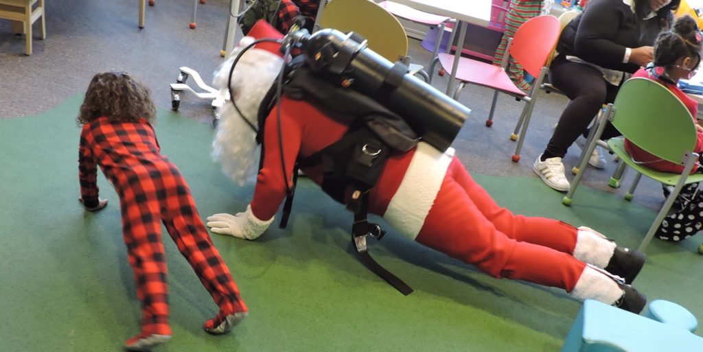 Scuba Santa Swims In to Surprise Pediatric Patients - Inside Cooper